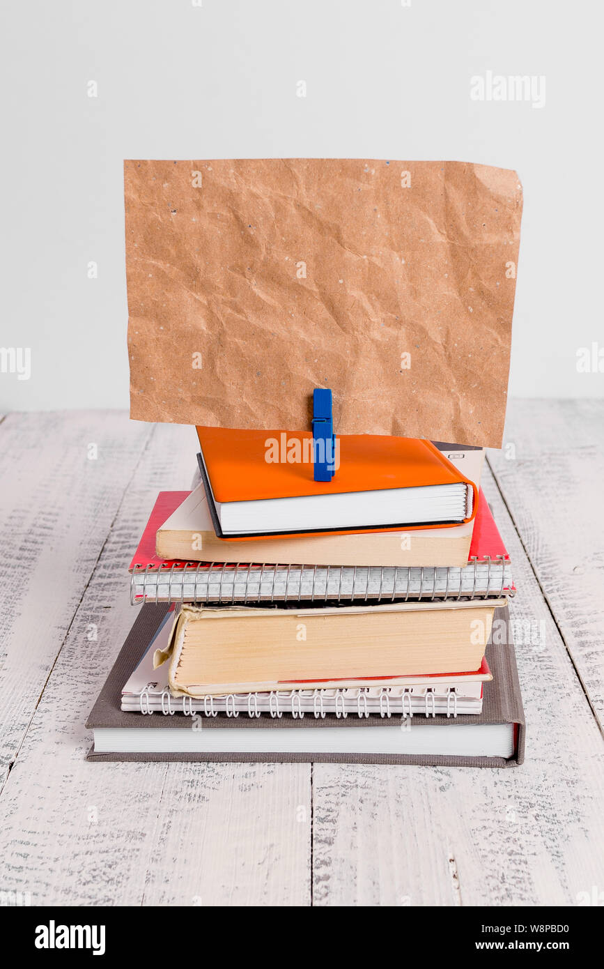 pile stacked books notebook pin clothespin colored reminder white ...