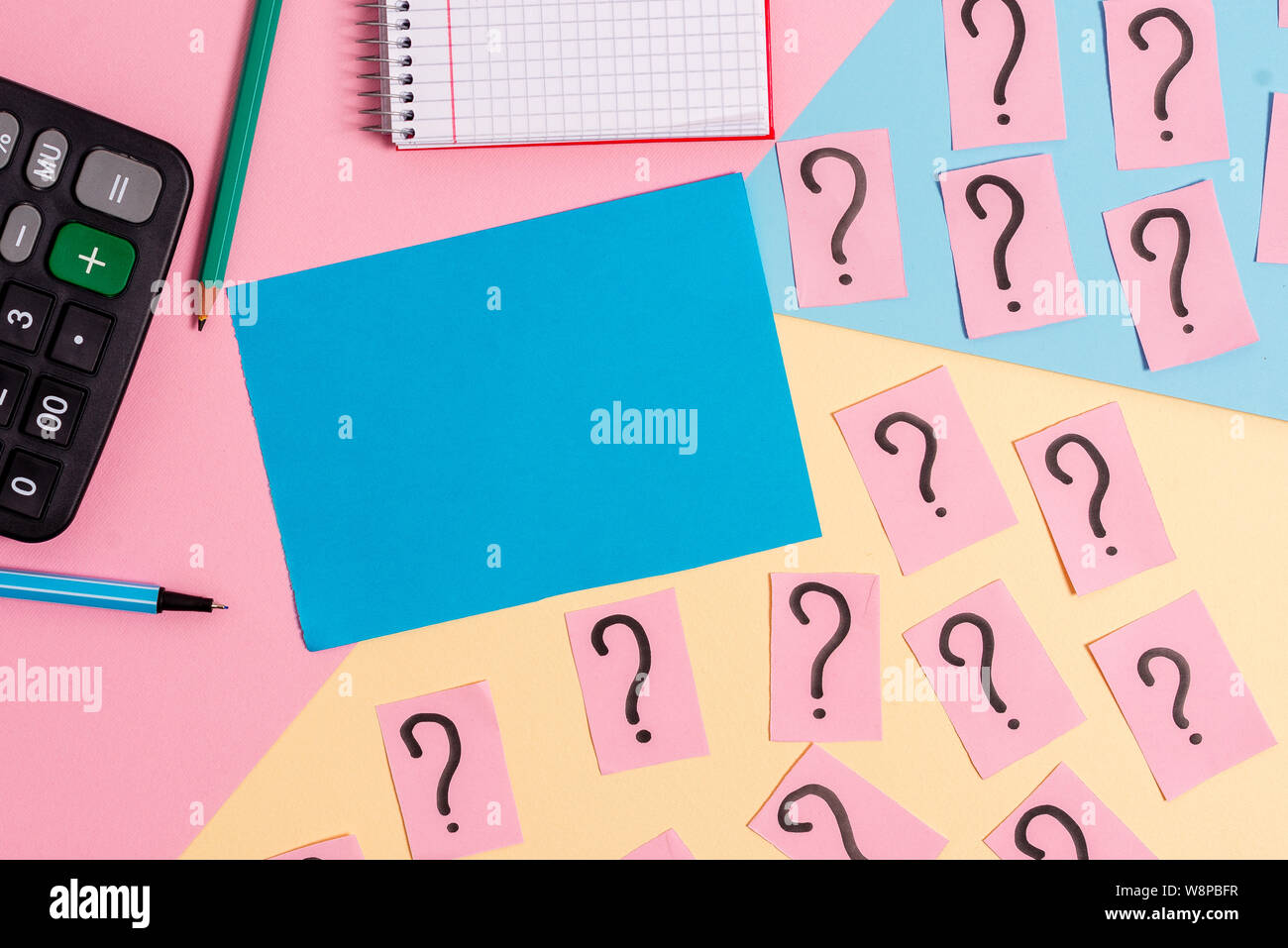 Mathematics stuff and writing equipment above pastel colours background ...