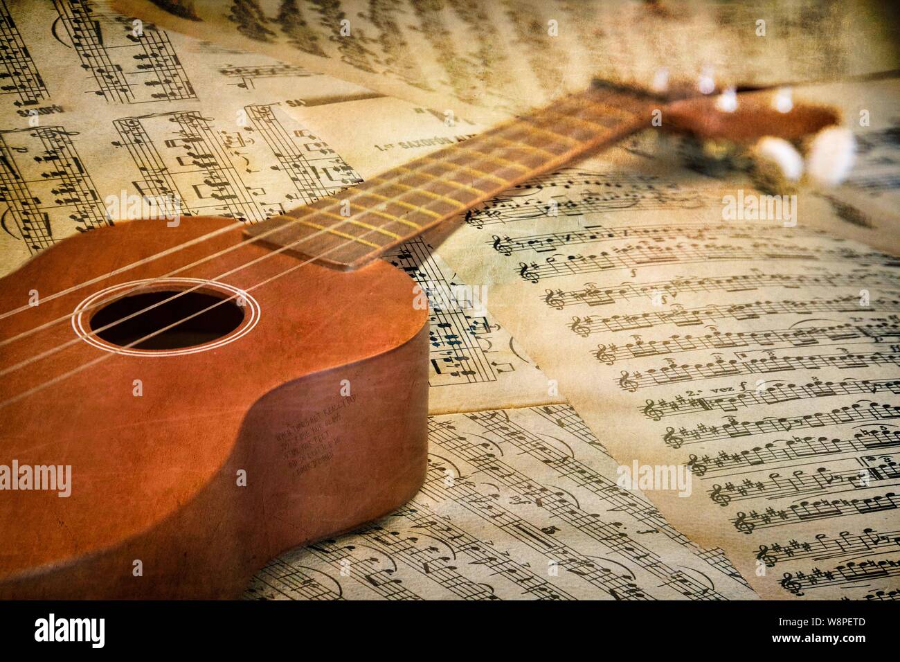 Dance a little jig. Hawaiian uke musical instrument laying on a layer ...