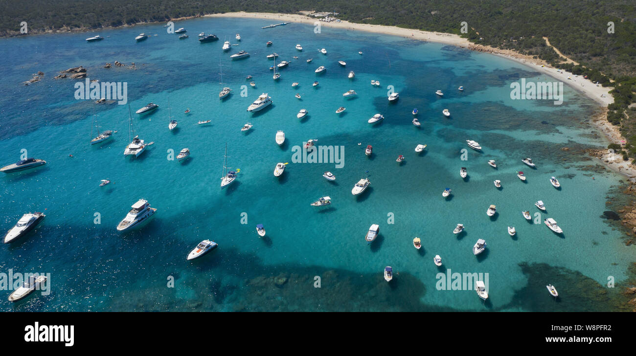 View from above, stunning aerial view of a beautiful bay full of boats ...
