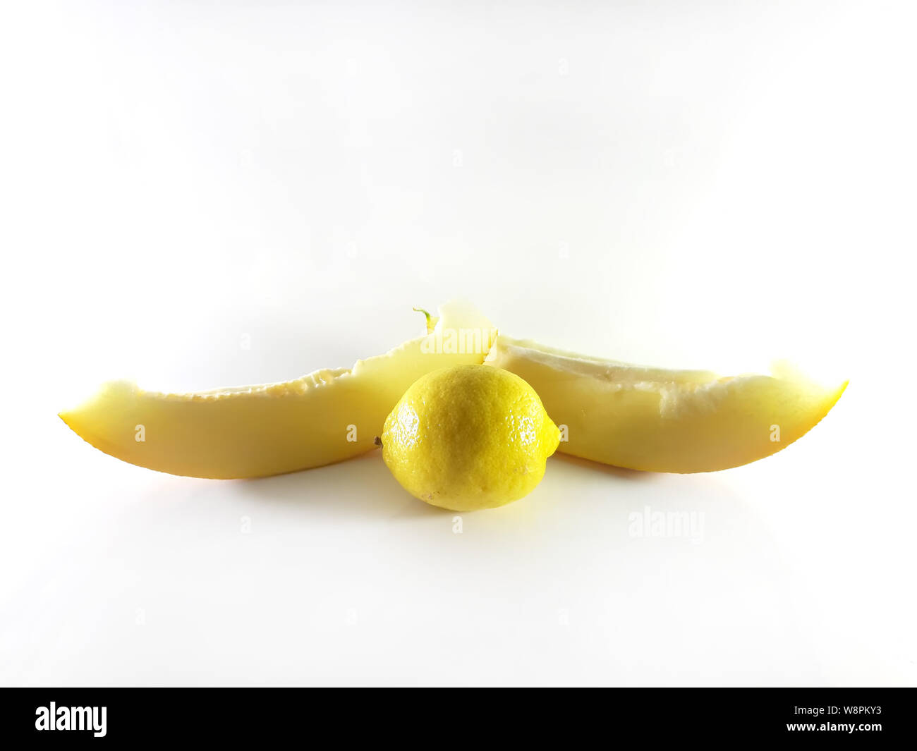 Yellow melon and lemon, white background. Vegetarian, diet food, photo ...