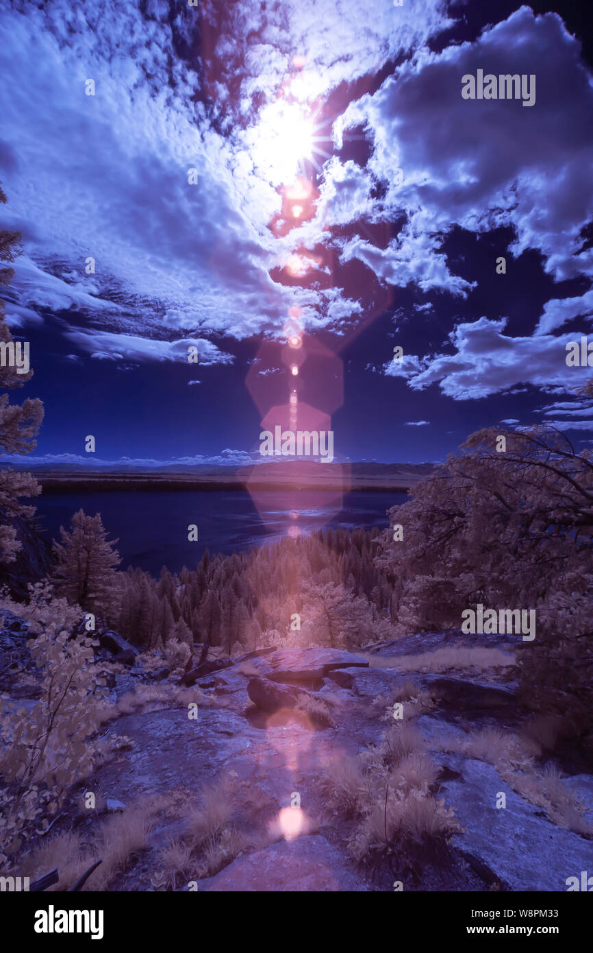 A lake in Montana with lens flare taken in Infra Red Stock Photo - Alamy