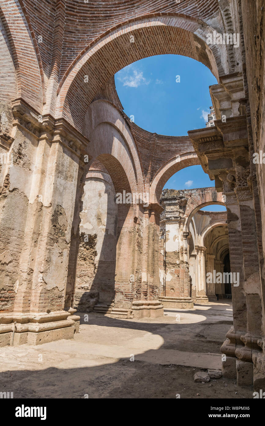 Stone architectural ruins with arches and sky, at the Antigua Guatemala ...