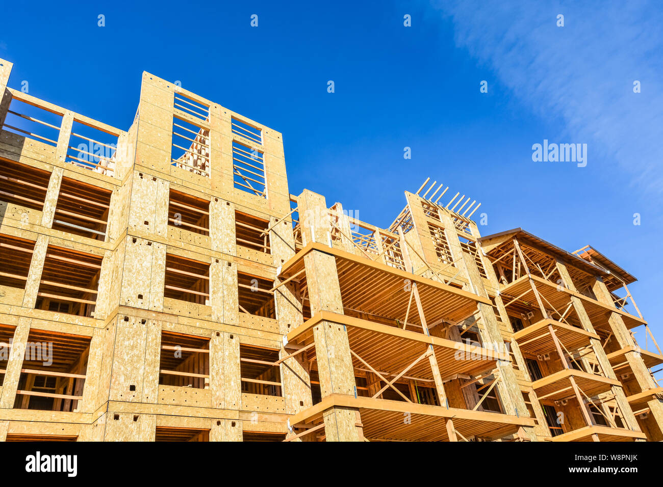 New low rise building under construction on blue sky background on ...