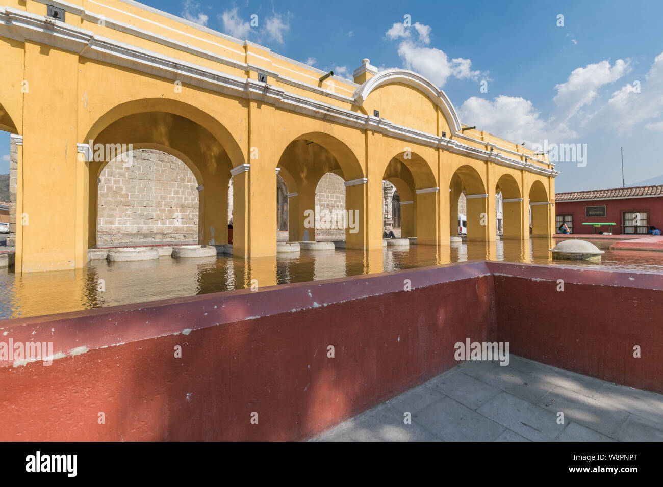 Ancient stone washing basins with architectural arches, in yellow and ...