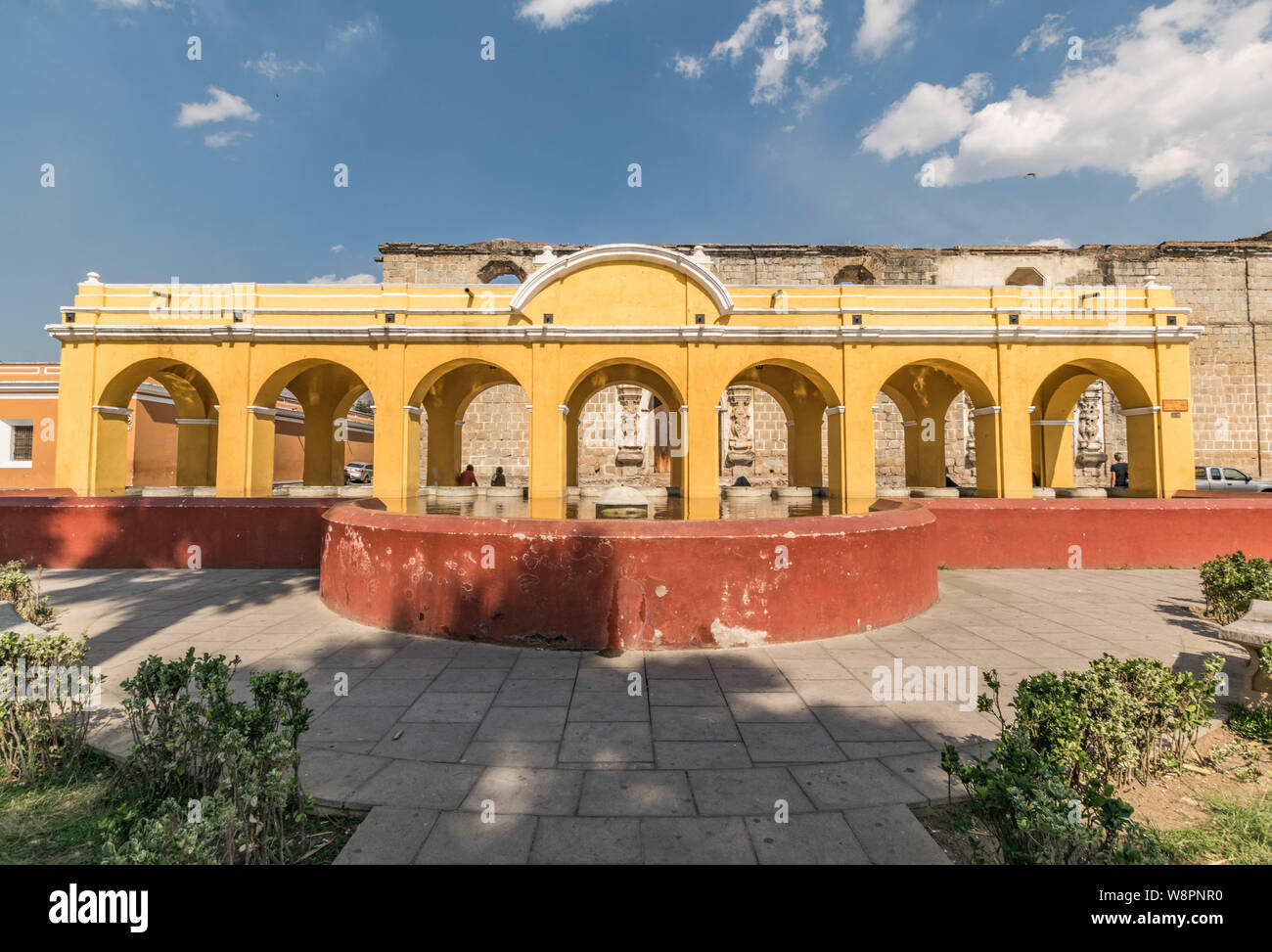 Ancient stone washing basins with architectural arches, in yellow and ...