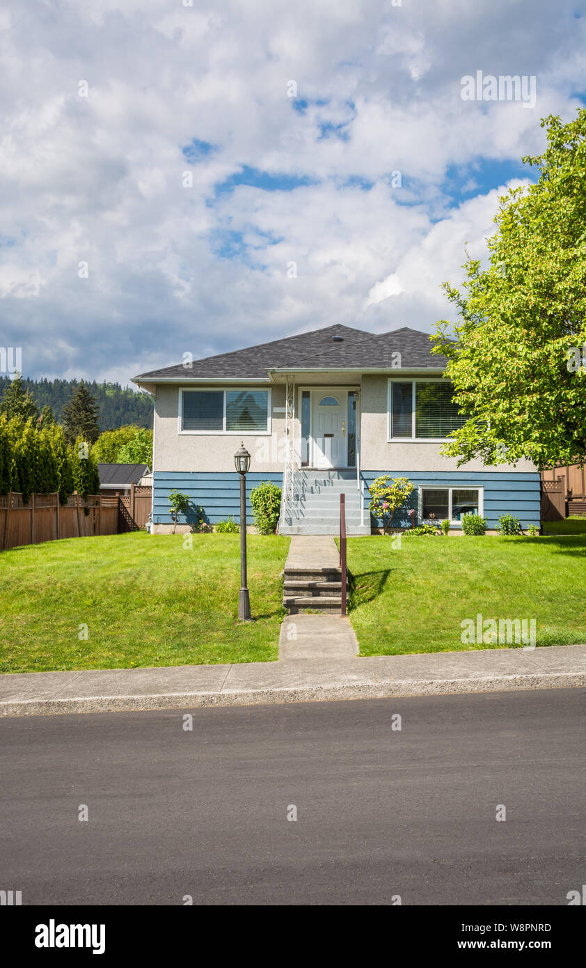 Average North American family house on cloudy sky background Stock ...