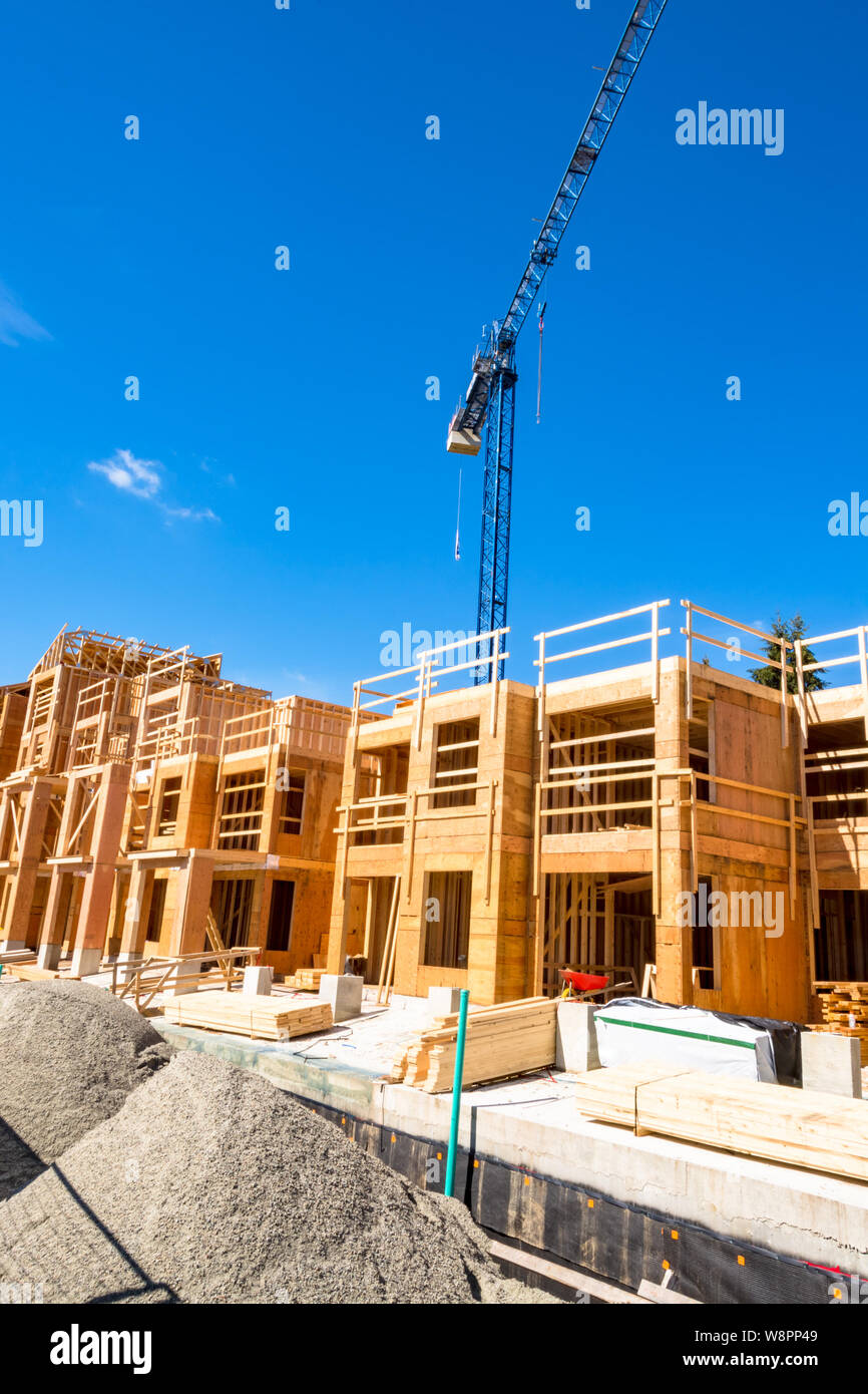 New residential building under construction with the crane above Stock ...