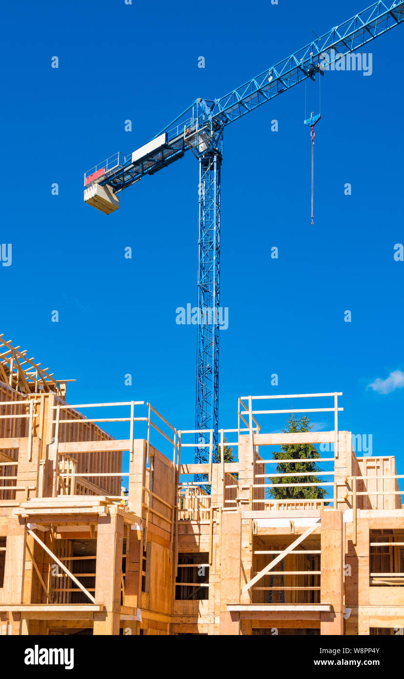 New residential building under construction with the crane above Stock ...