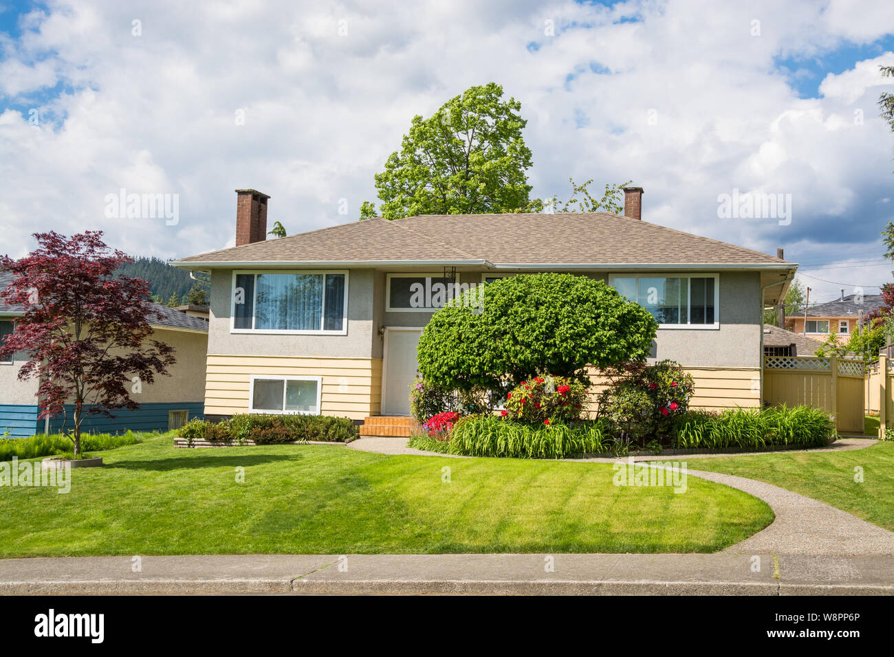 Average North American family house on cloudy sky background Stock ...