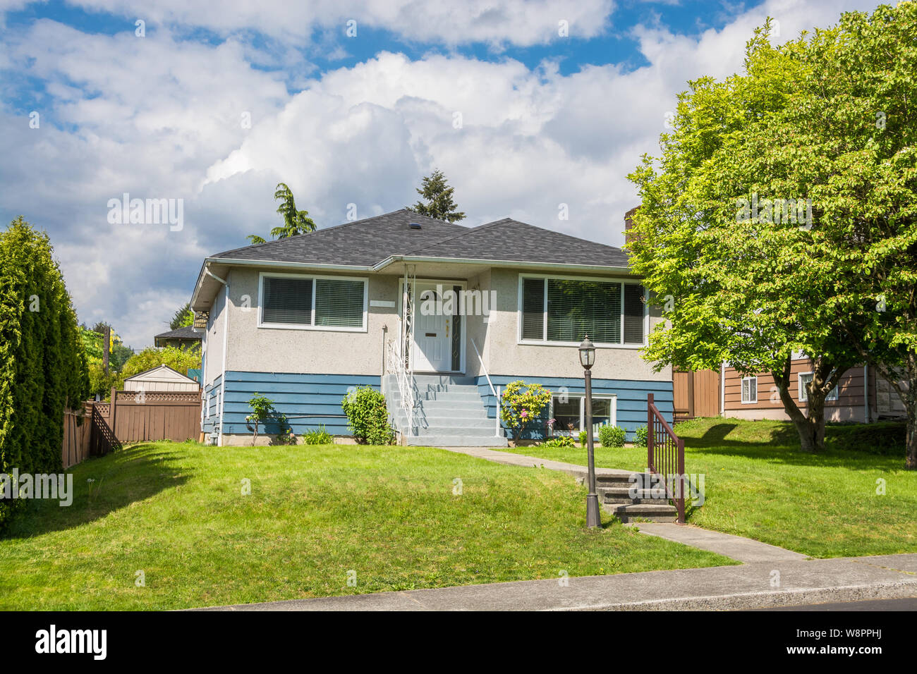 Average North American family house on cloudy sky background Stock ...