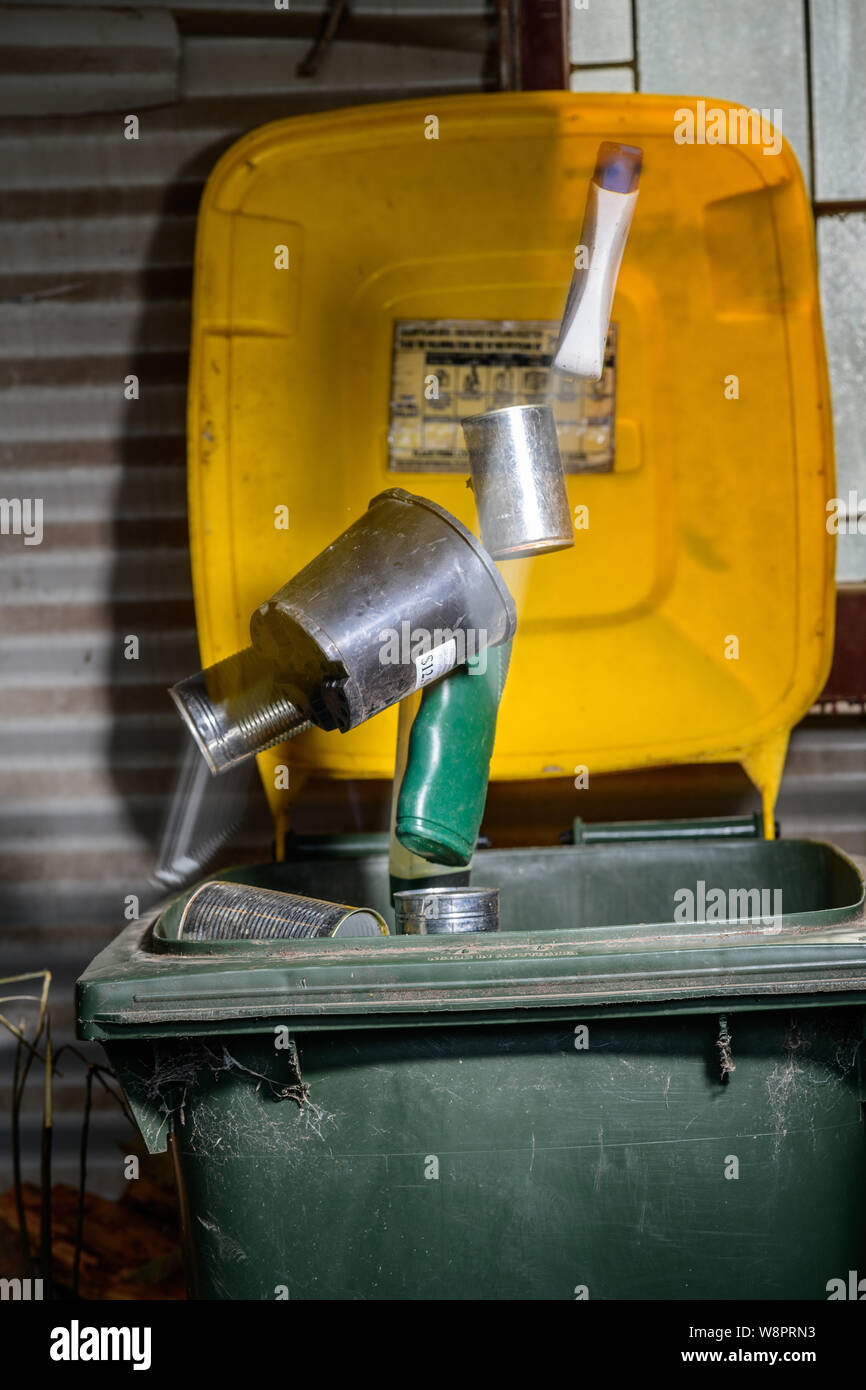Filling the household Recycling Bin with plastic containers and empty ...