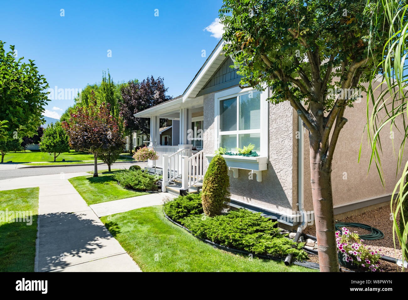 Entrance of residential house with concrete pathway in front of the ...