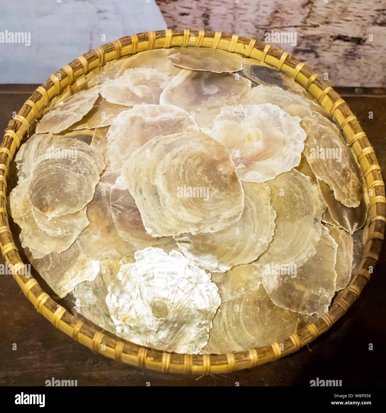 Dried fish shells piled on a weaved wooden basket Stock Photo - Alamy