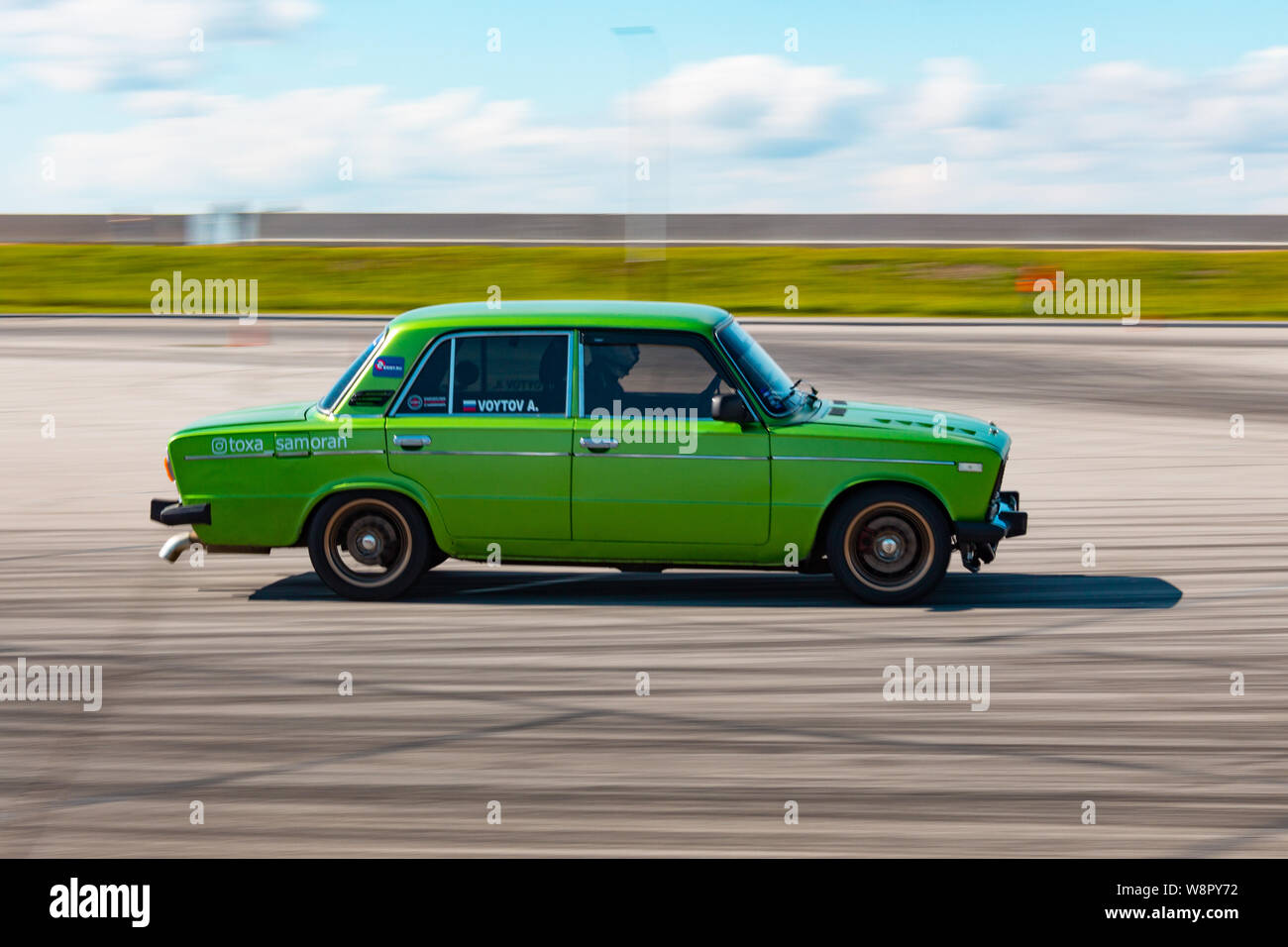 The guy on the car Lada green trains to drift Stock Photo - Alamy