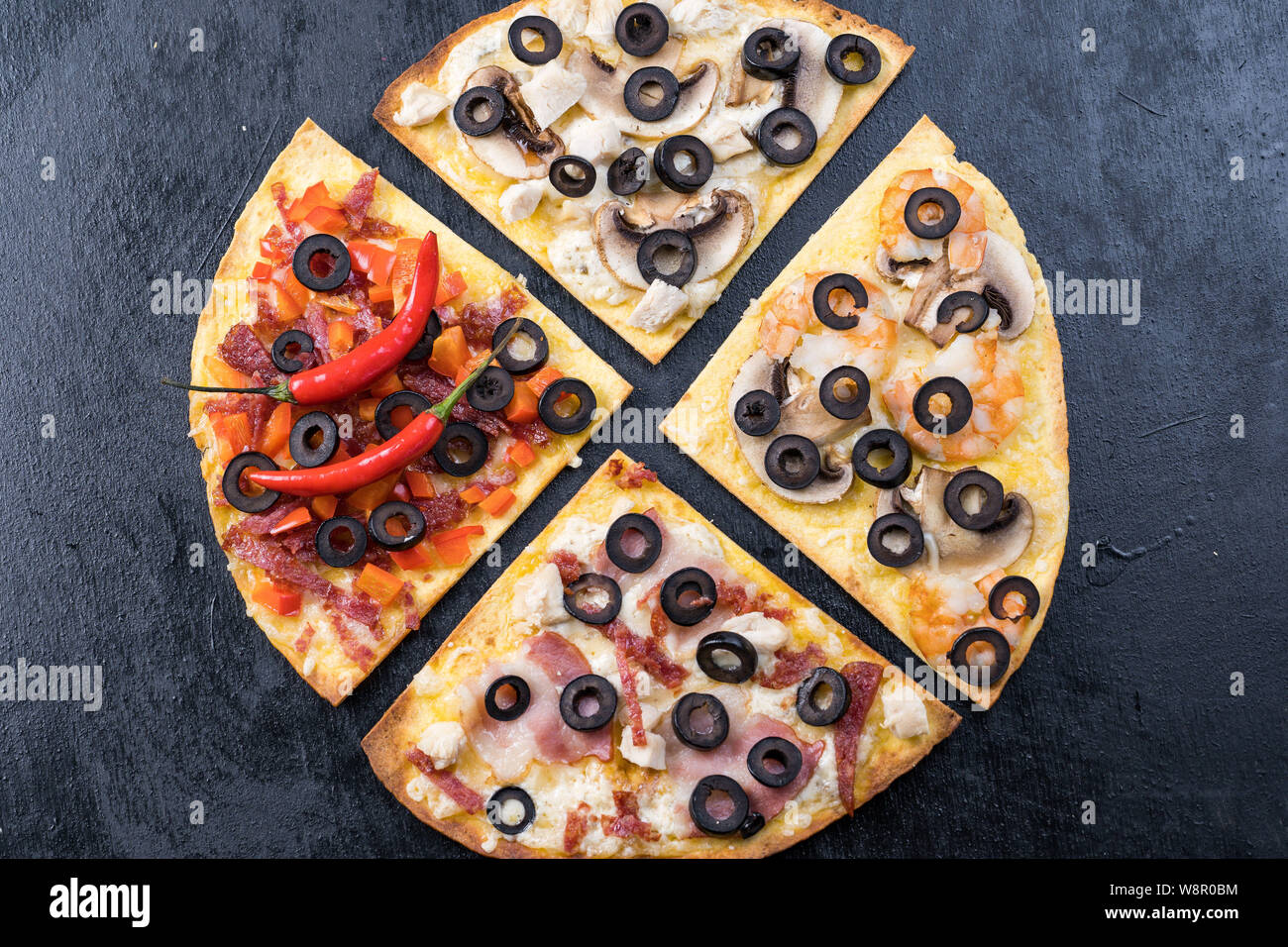 Assorted pizza slices. Margherita, pepperoni, four cheese pizza. Top ...