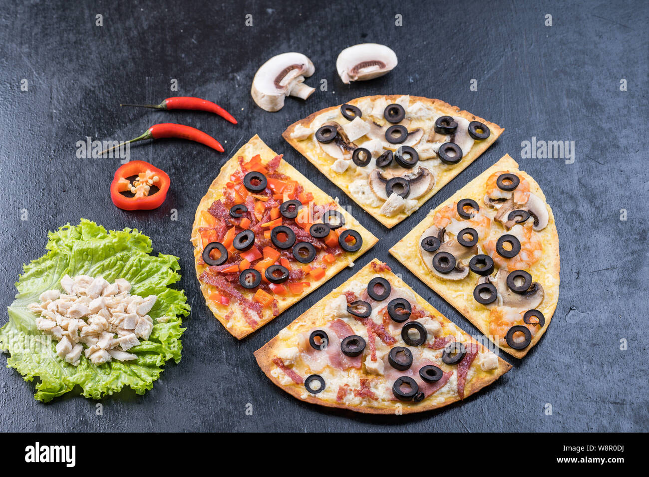 Assorted pizza slices. Margherita, pepperoni, four cheese pizza. Top ...