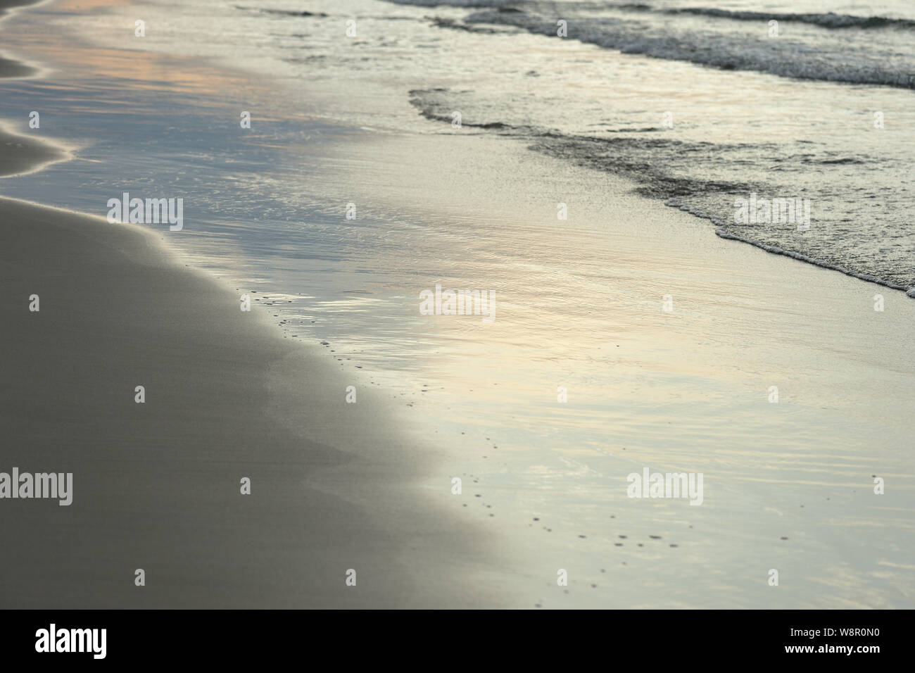 Sun reflection on sand and water hi-res stock photography and images ...