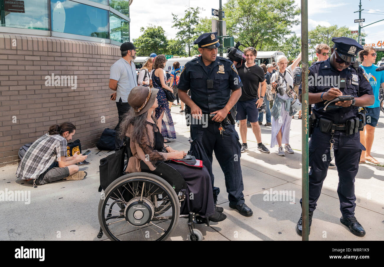 New York, NY - August 10, 2019: Police officer issues summon for ...