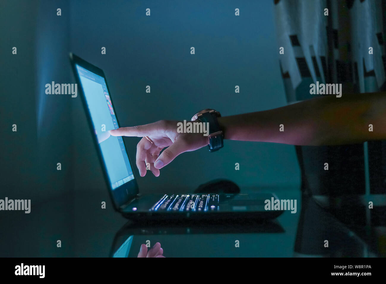 A human interacting with technology Stock Photo - Alamy