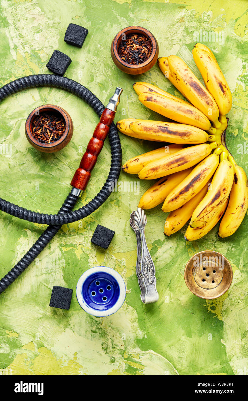 Tobacco shisha with banana aroma.Kalian with banana Stock Photo - Alamy