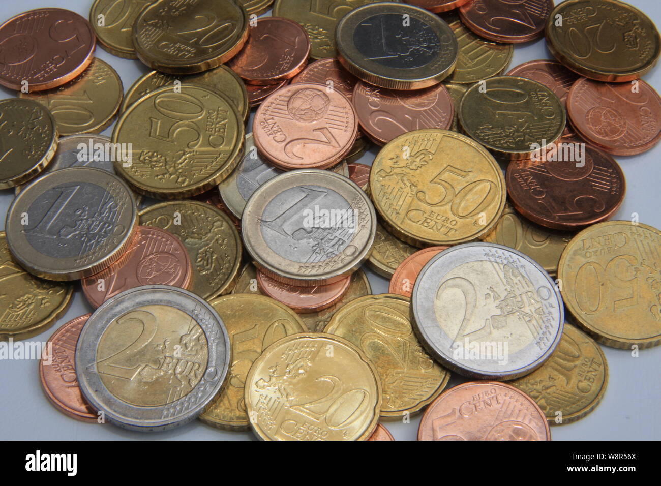 Banknotes and small change on a table Stock Photo - Alamy