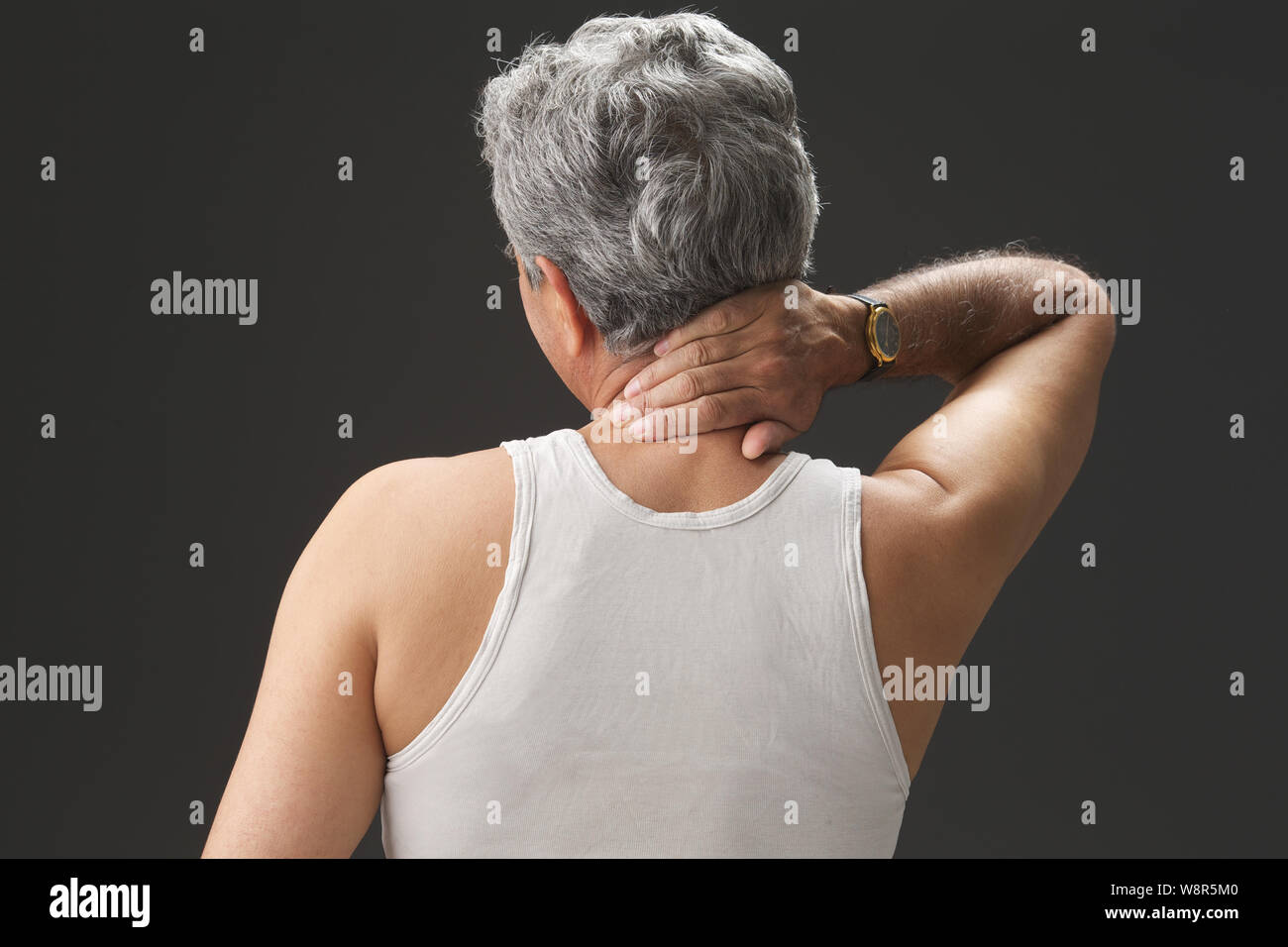 Old man suffering from neck pain Stock Photo - Alamy