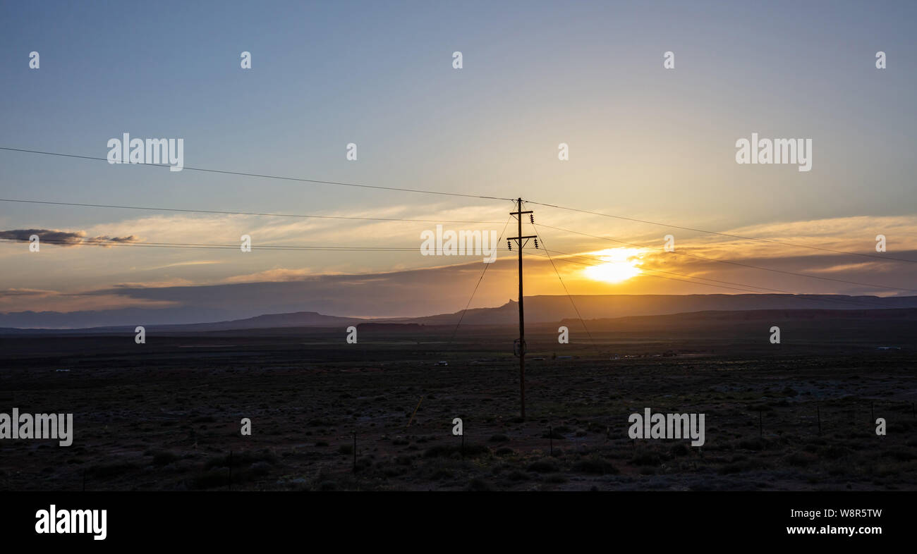 Desert landscape, US. Sun falling, blue sky background with clouds ...