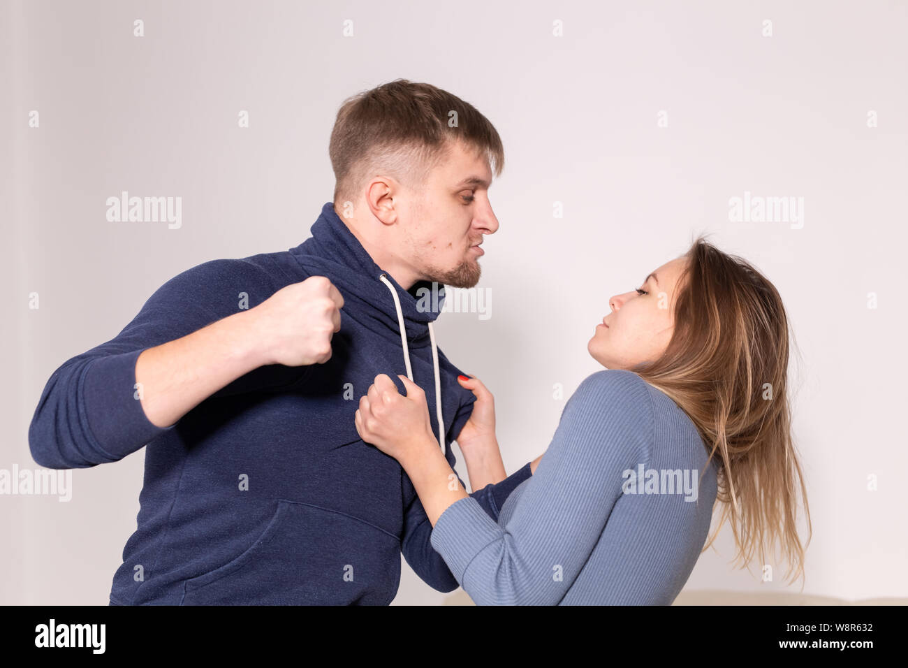 People and abuse concept - Portrait of angry young man try to hit the ...