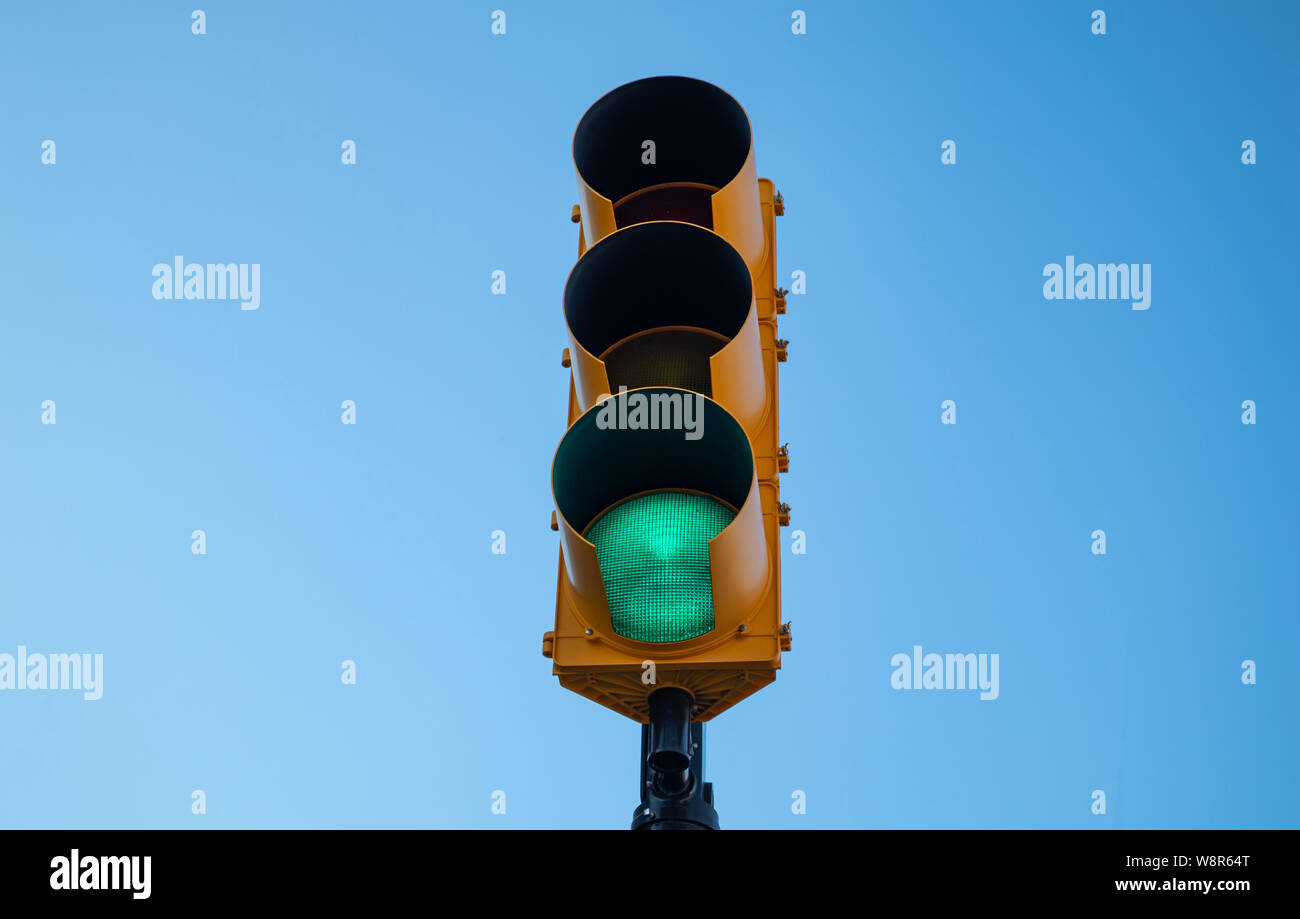 Go sign. Green traffic light for cars, blue sky background Stock Photo ...