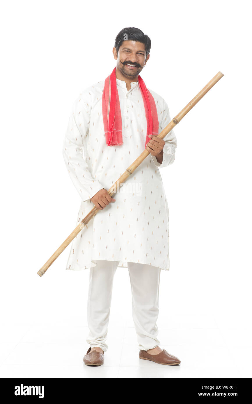 Rural man standing with his cane Stock Photo - Alamy