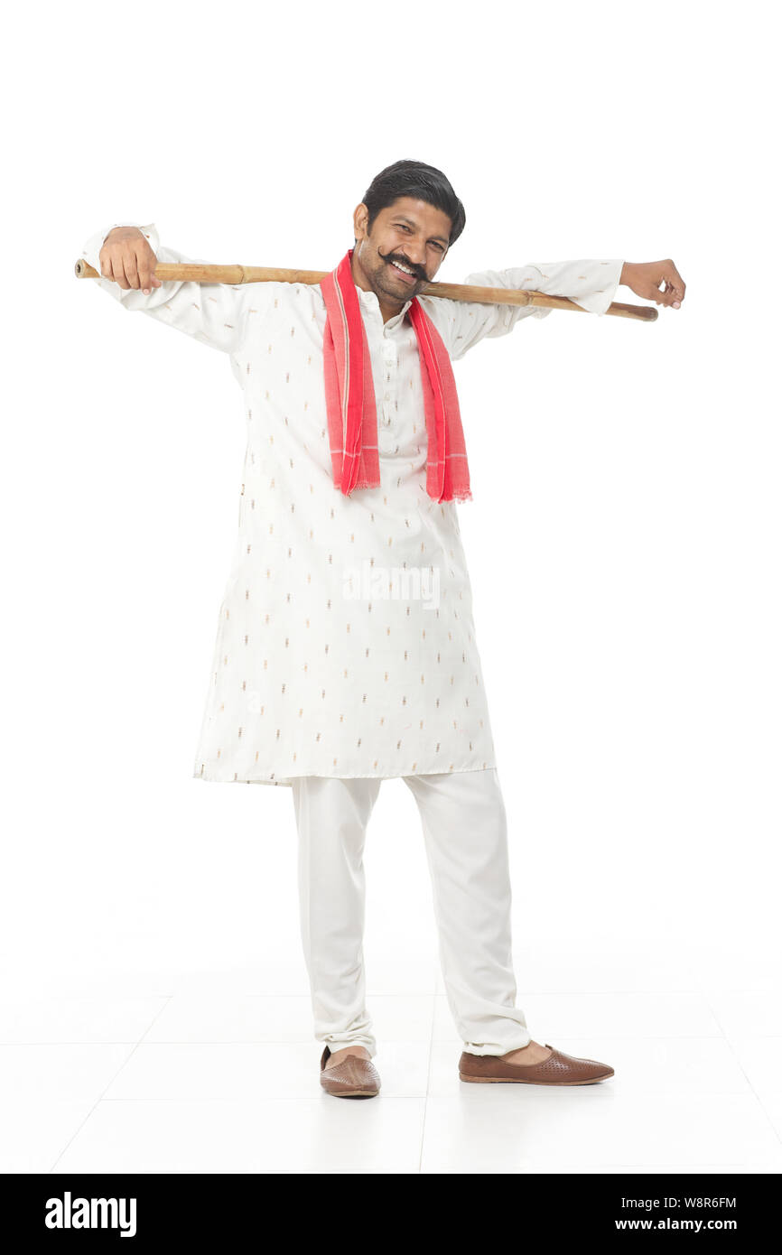 Rural man standing with his cane Stock Photo - Alamy