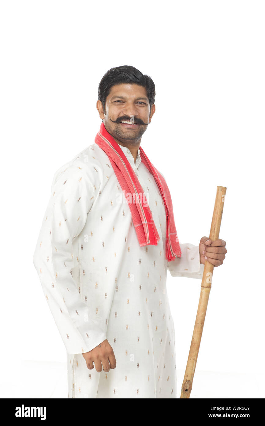 Rural man standing with his cane Stock Photo - Alamy