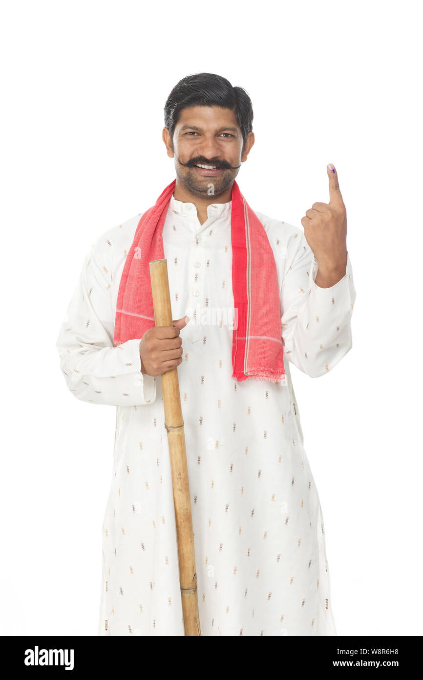 Rural man standing and pointing upward Stock Photo - Alamy