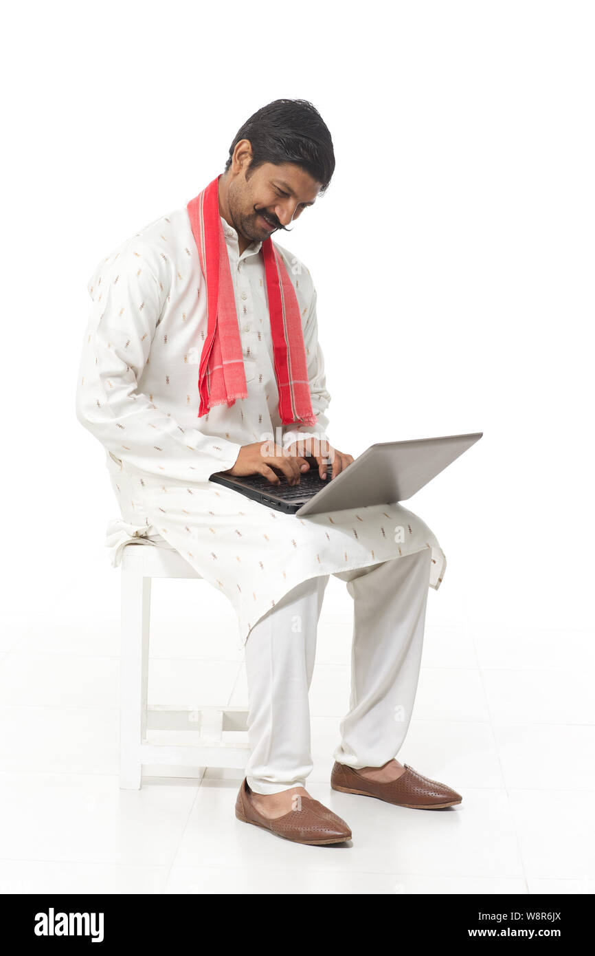 Rural man working on a laptop Stock Photo - Alamy