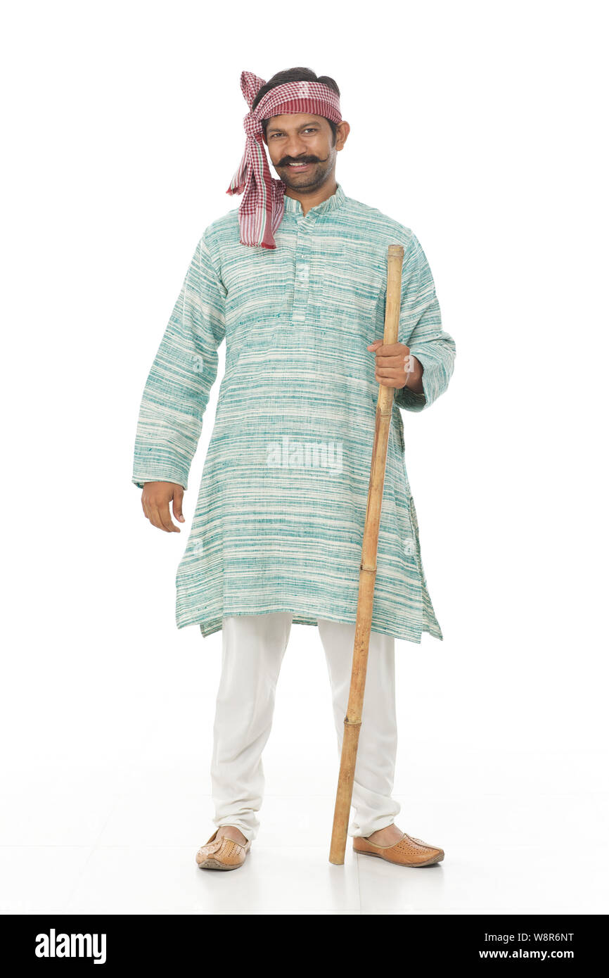 Rural man standing with his cane Stock Photo - Alamy