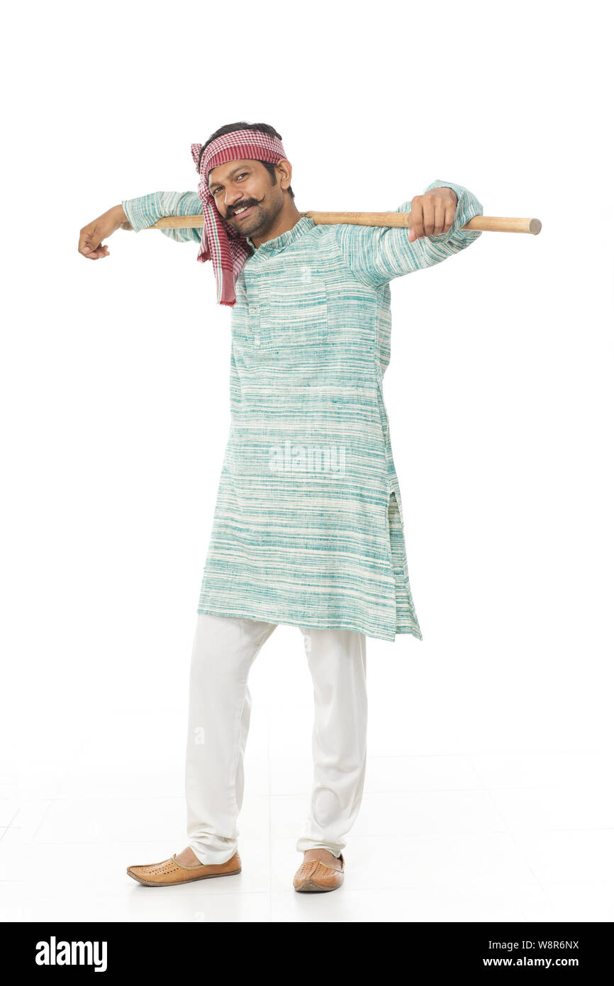 Rural man standing with his cane Stock Photo - Alamy