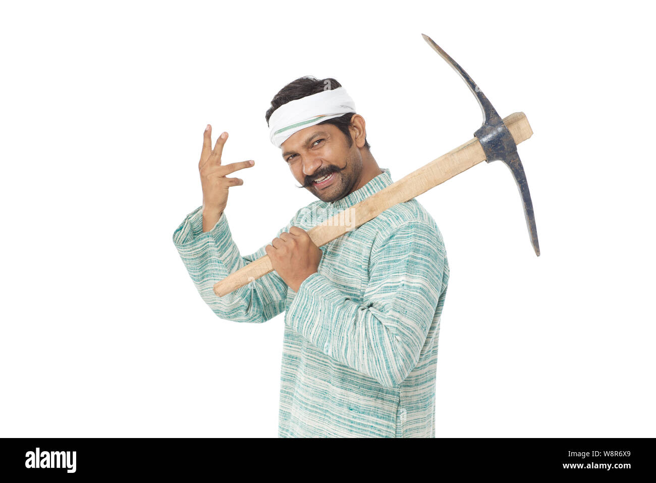 Farmer carrying a pick axe on shoulder isolated on white background ...