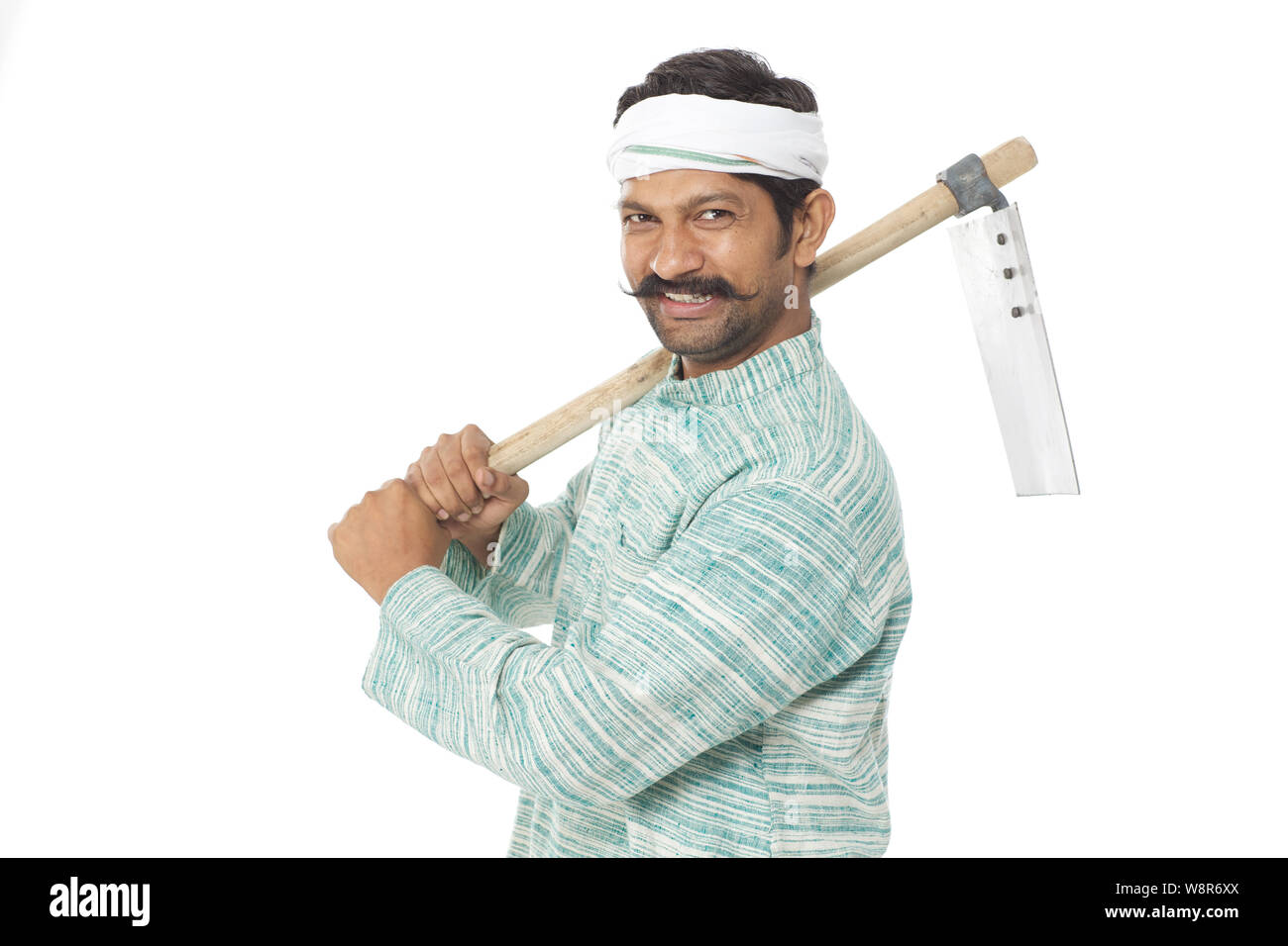 Farmer standing with a hoe isolated on white background Stock Photo - Alamy