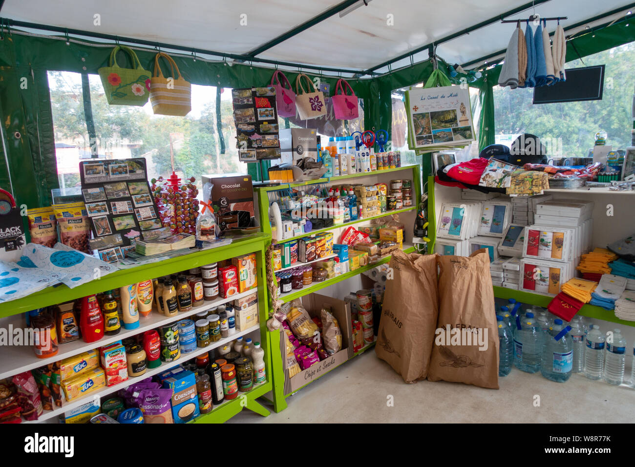 Small village boat shop interior with fresh bread and goods in France ...