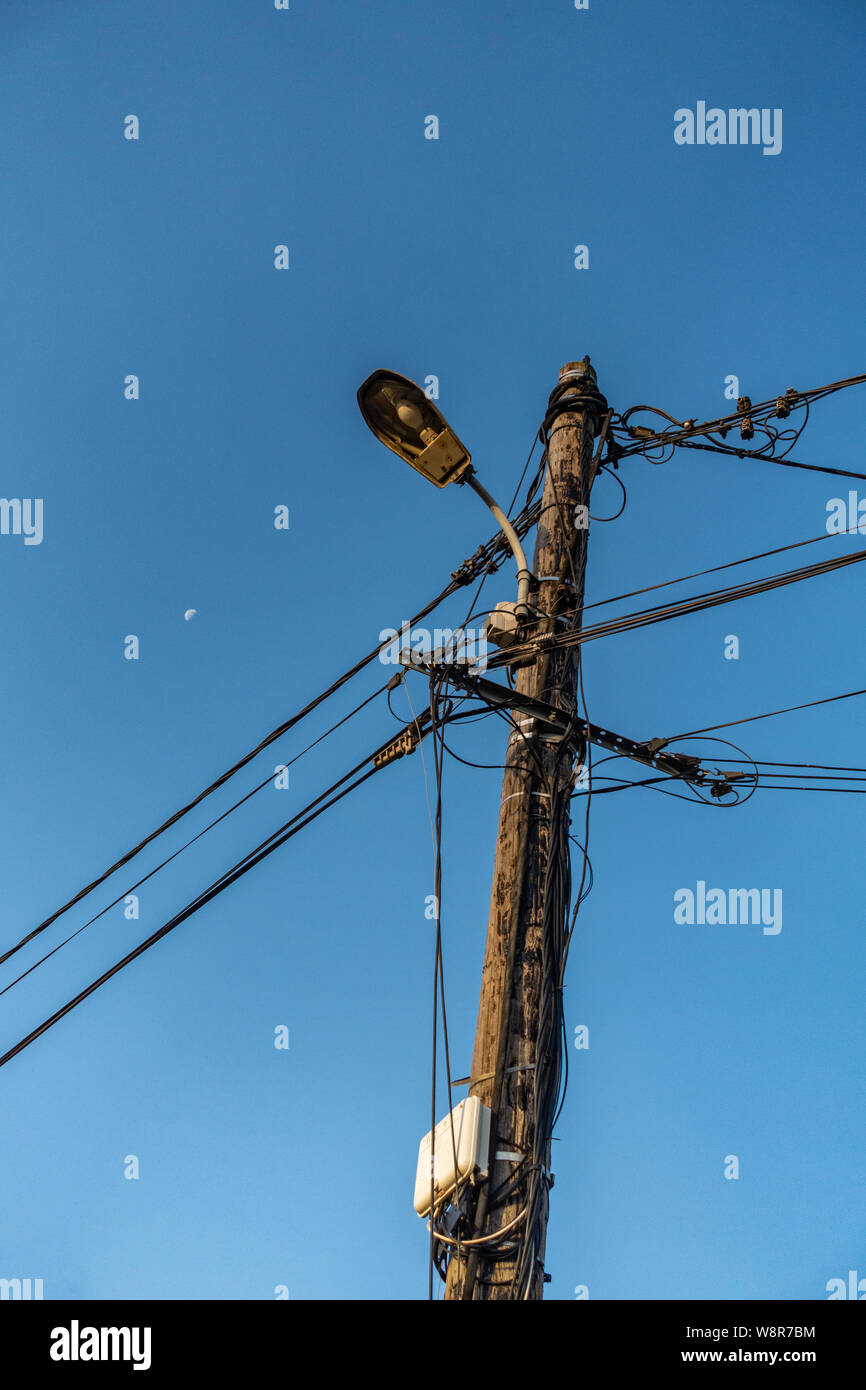 electricity power cables on pole with street light Stock Photo - Alamy