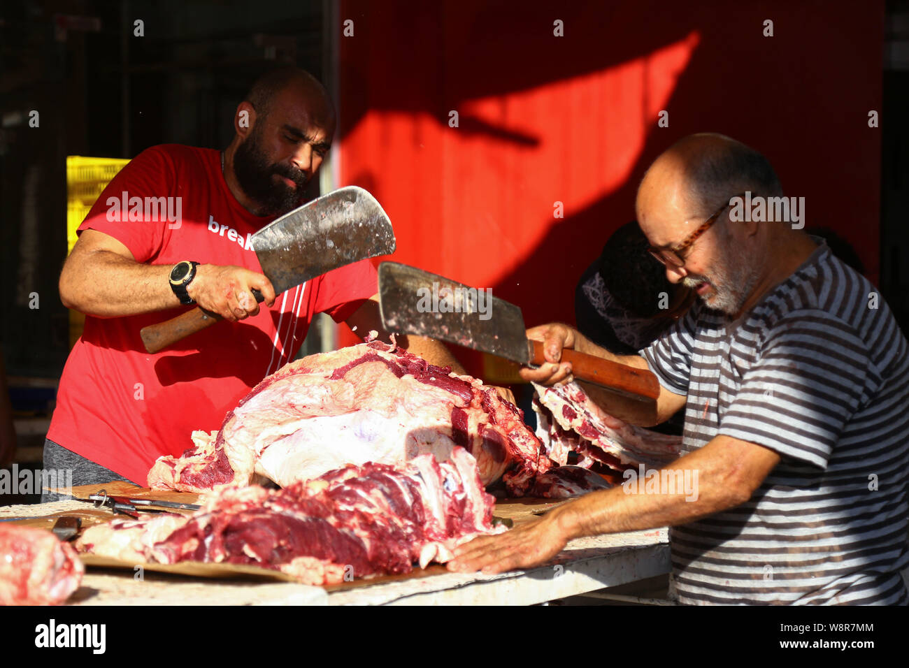 Cairo, Egypt. 11th Aug, 2019. Egyptian Muslims slaughter goats and ...