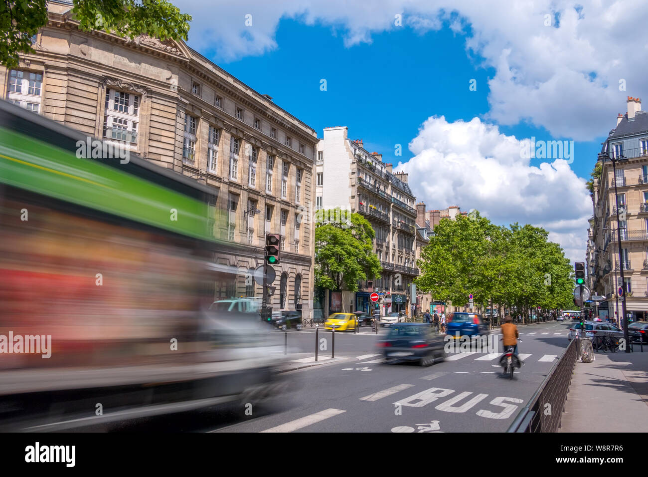 France. Paris. Street in the city center with busy traffic. Sunny ...