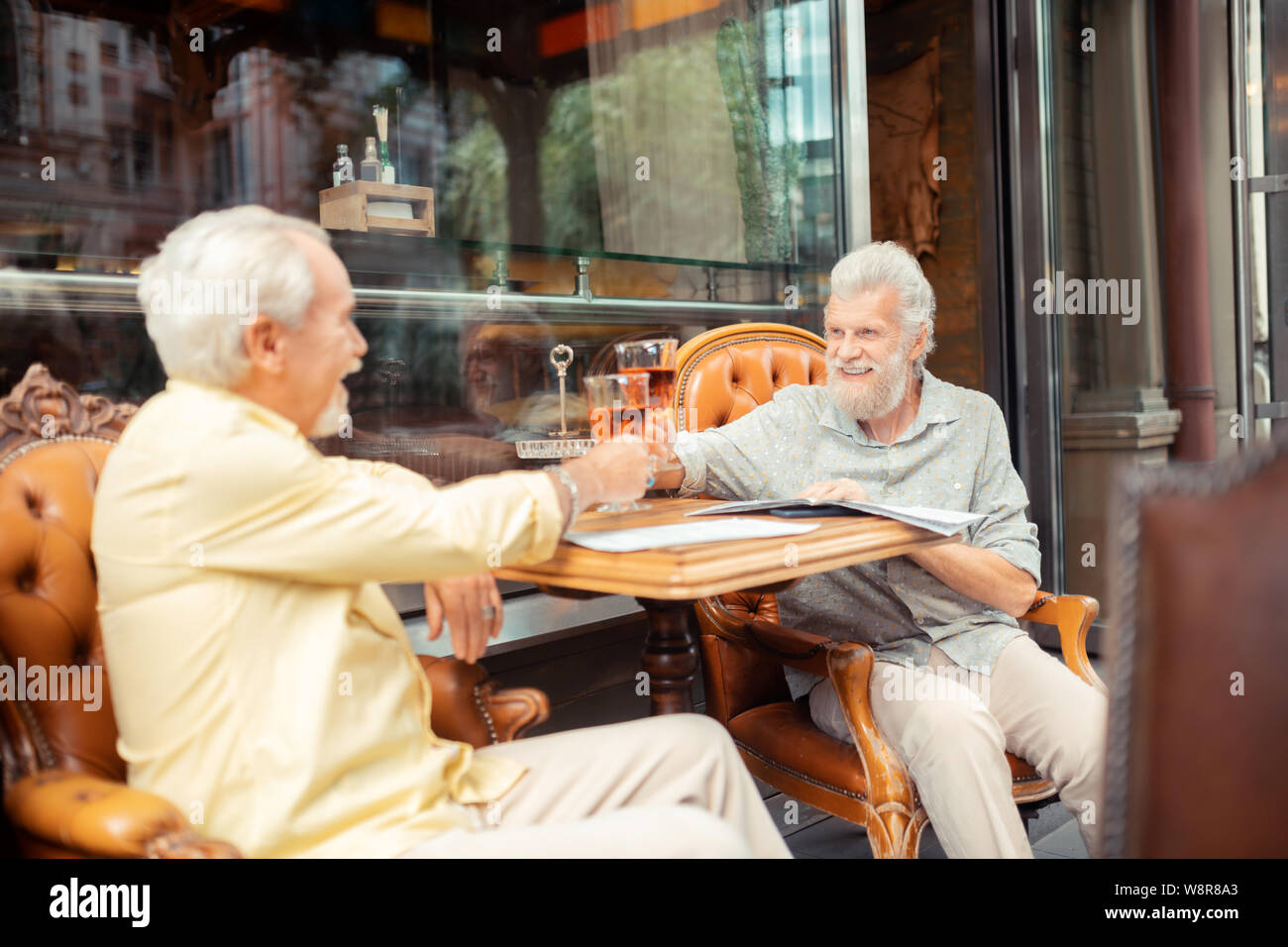 Two old friends enjoying their meeting after many years Stock Photo - Alamy