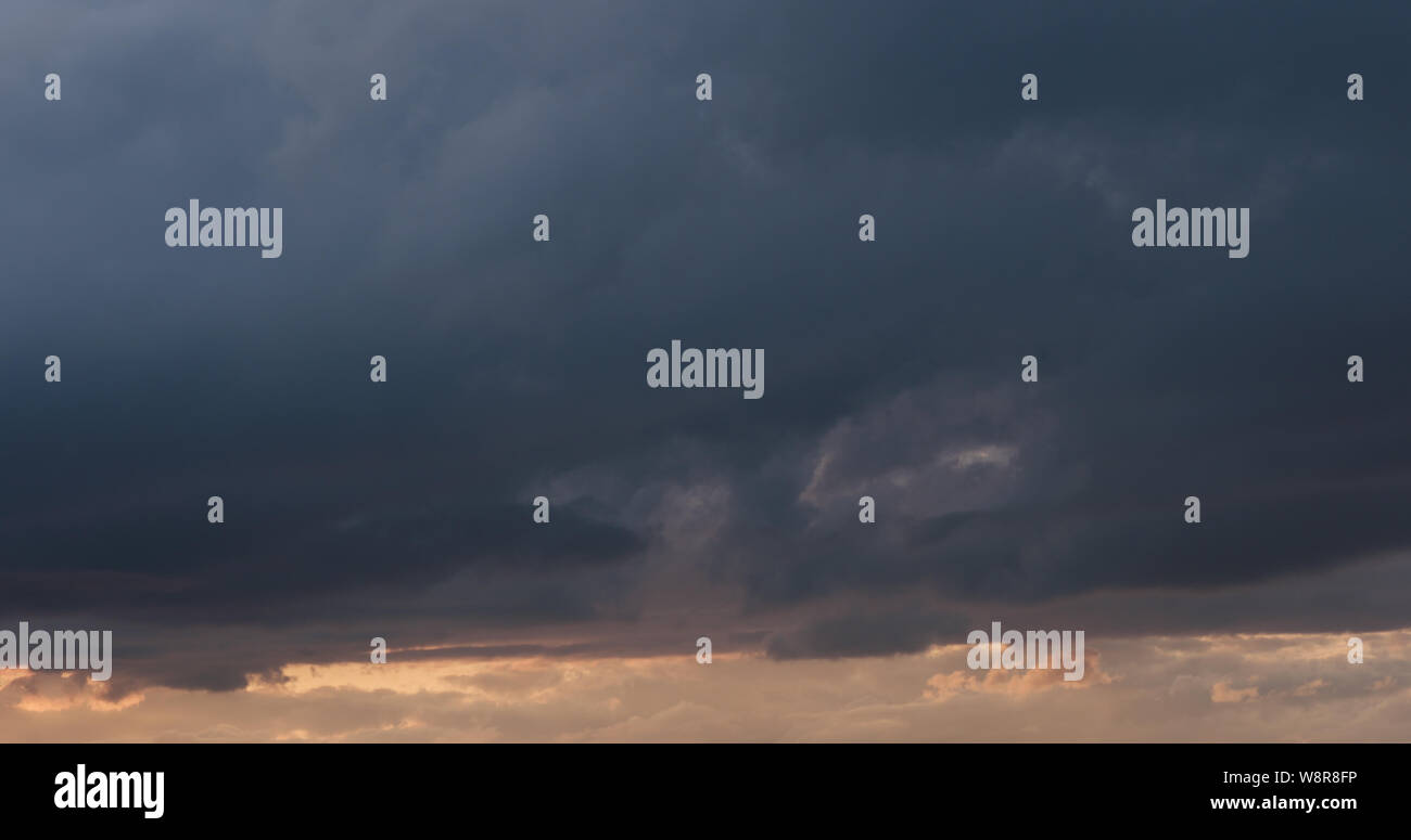 summer sunset skyscape with moving clouds, wide photo Stock Photo - Alamy