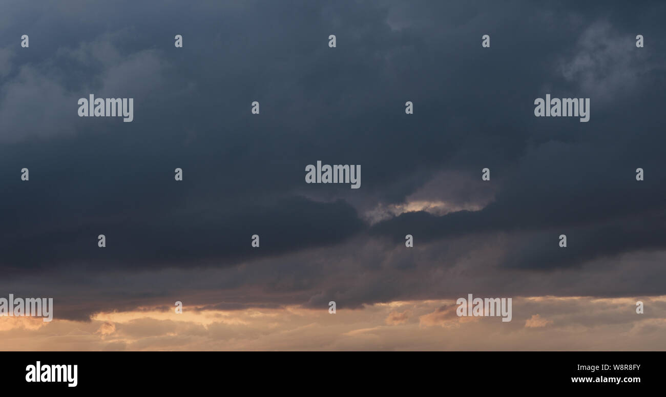 summer sunset skyscape with moving clouds, wide photo Stock Photo - Alamy