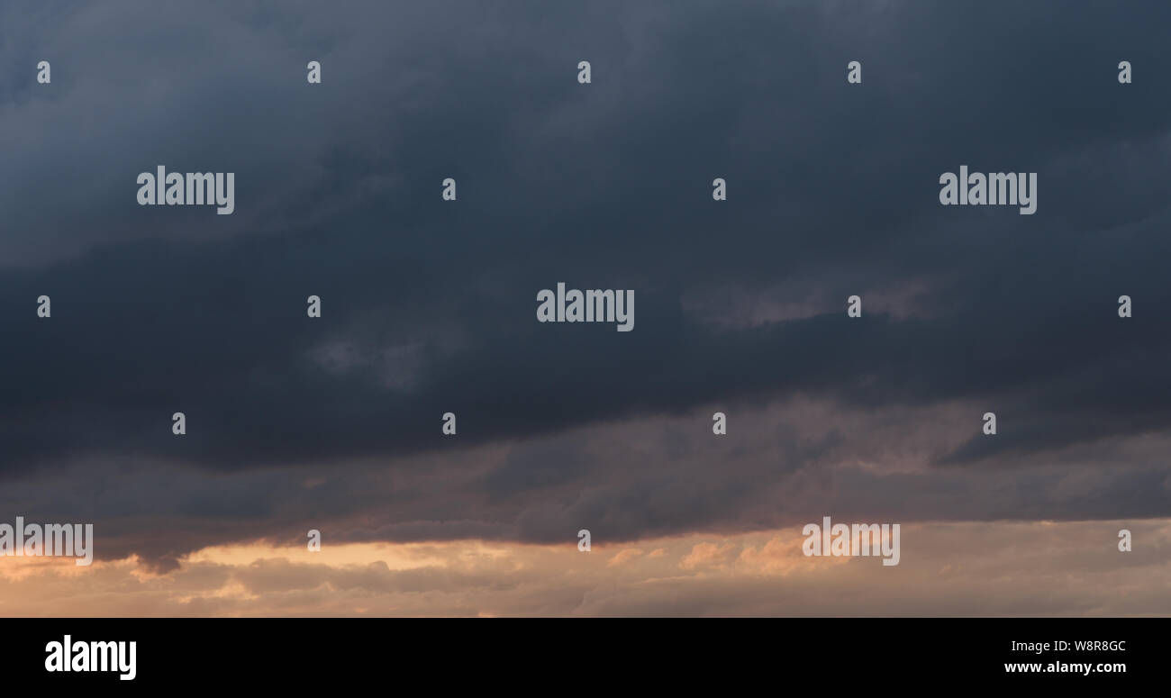 summer sunset skyscape with moving clouds, wide photo Stock Photo - Alamy
