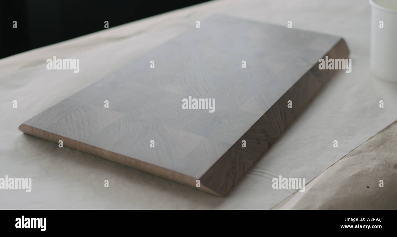 untreated end graind cutting board from walnut in workshop, wide photo ...