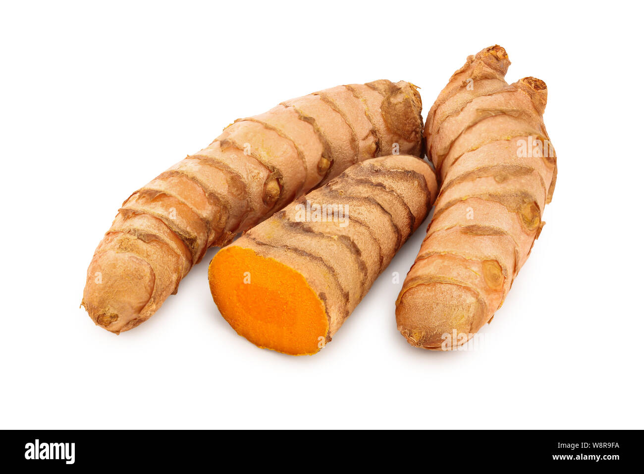 turmeric root isolated on white background closeup Stock Photo - Alamy