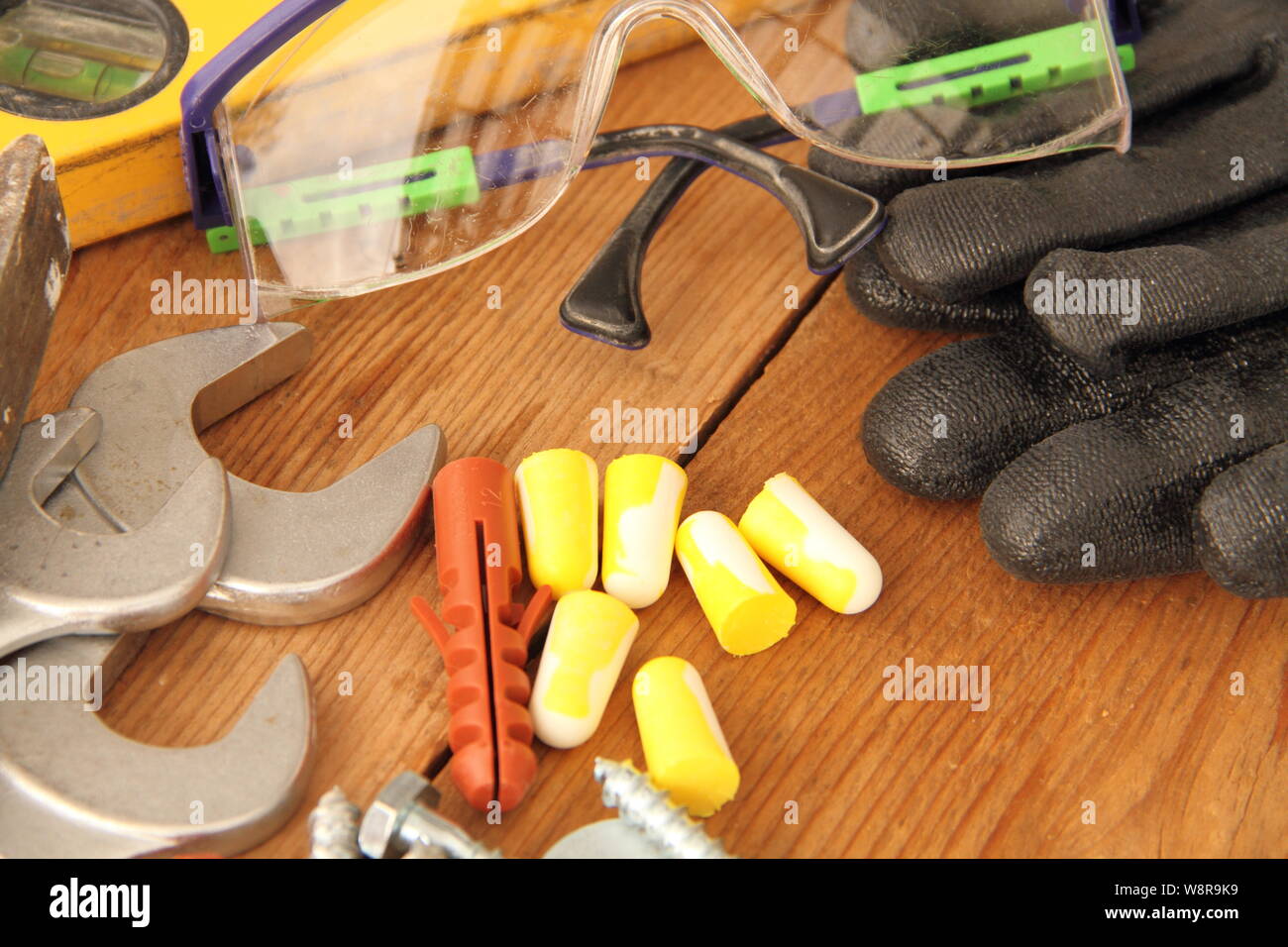 Gloves with tool on a workbench Stock Photo - Alamy